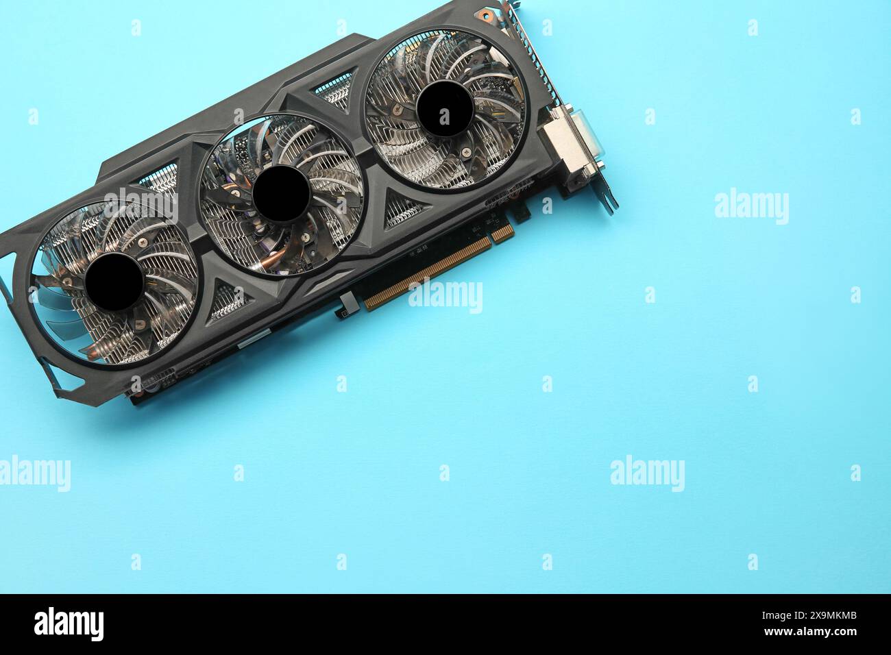 One graphics card on light blue background, top view. Space for text ...