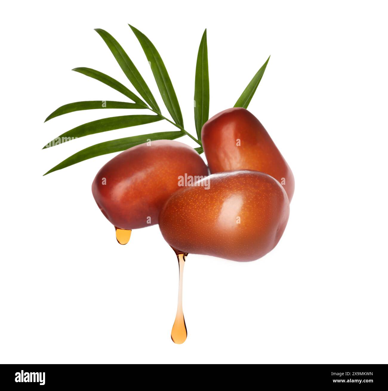 Oil dripping from palm fruits on white background Stock Photo - Alamy