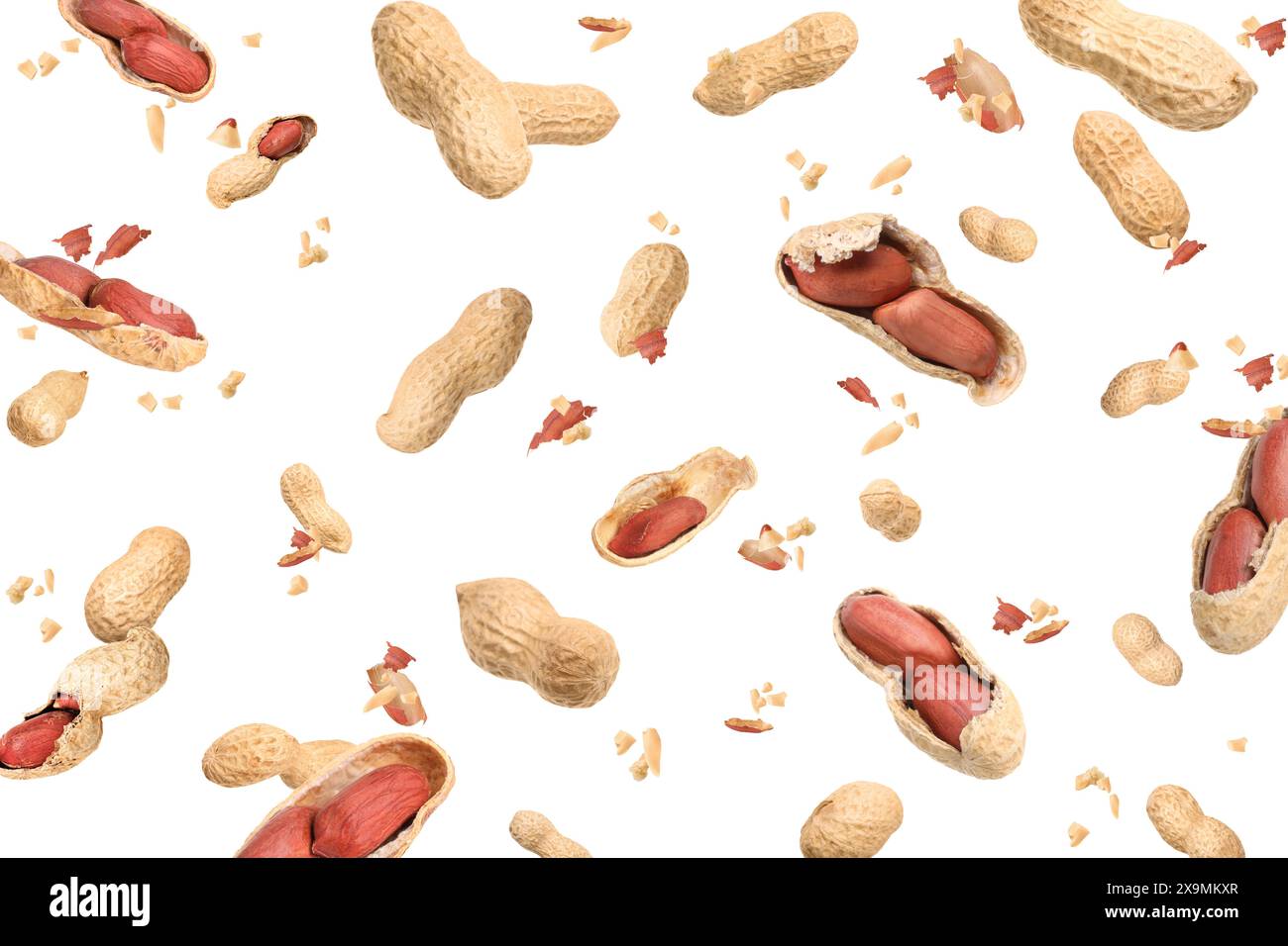 Unpeeled peanuts in air on white background Stock Photo - Alamy