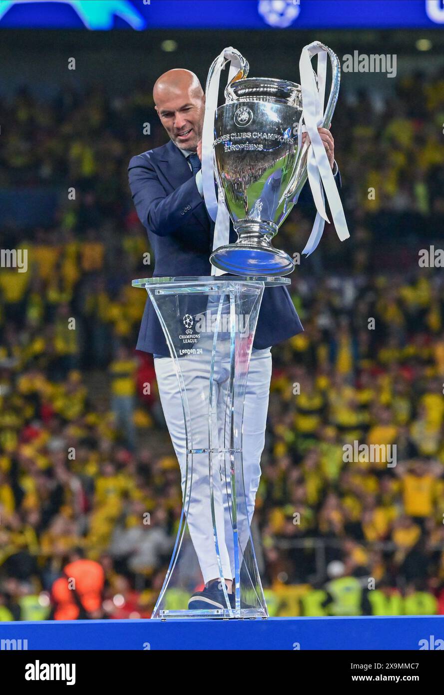London, England. 01st, June 2024. Zinedine Zidane carries the trophy to ...