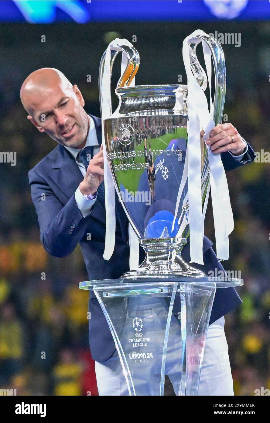 London, UK. 01st June, 2024. Zinedine Zidane carries the trophy to the ...