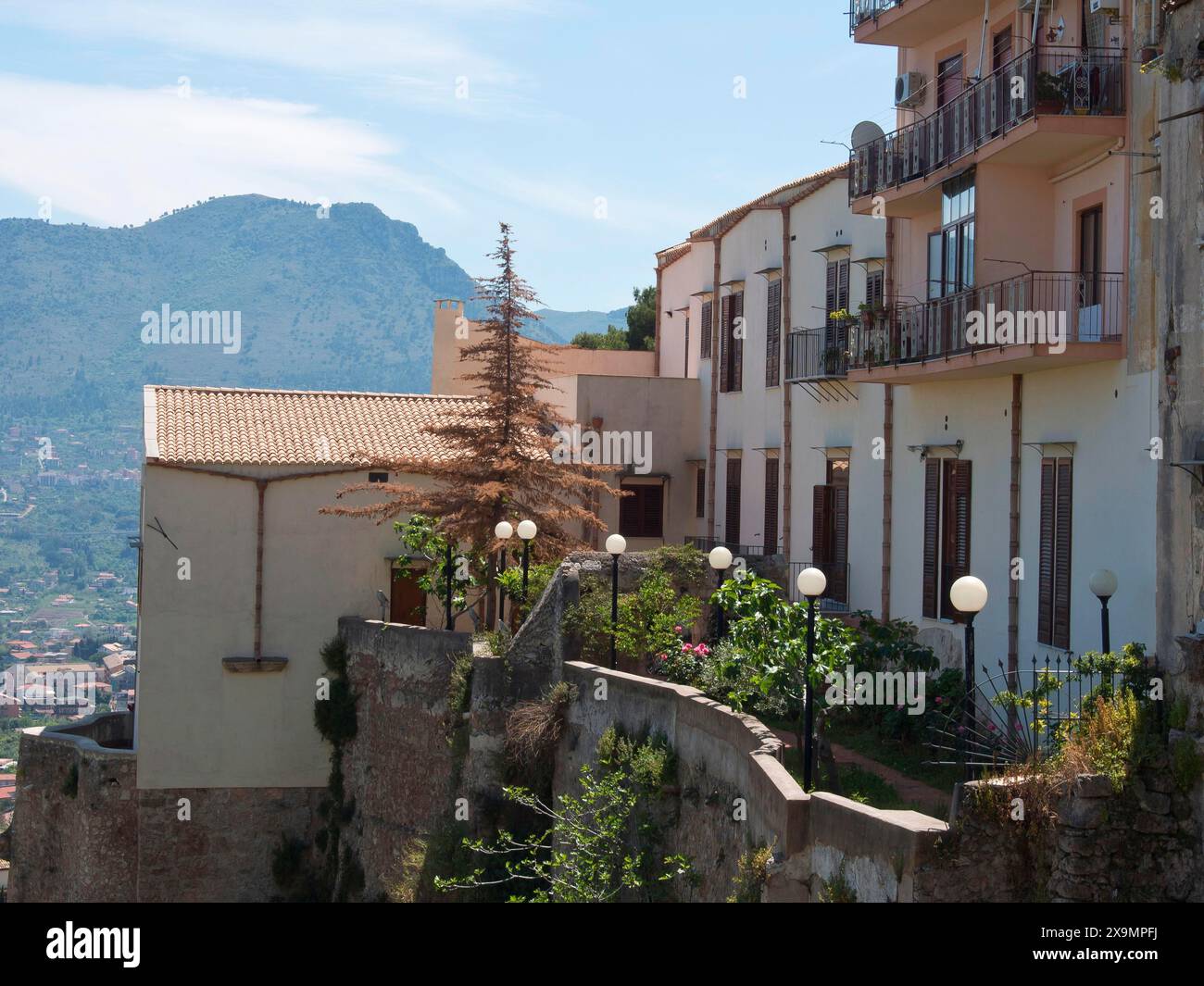 Village with houses on a hill, balconies and mountain landscape in the ...