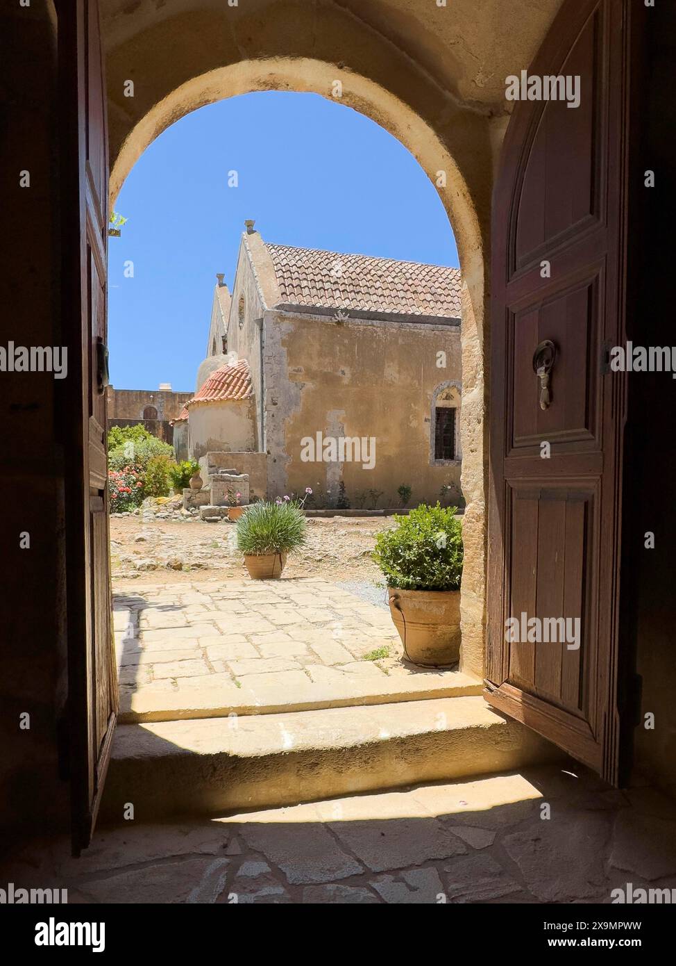 View through door Tor tor archway archway on back of two-aisled church ...