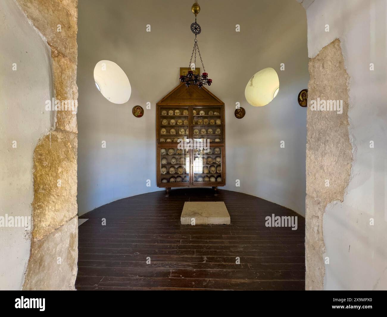 Historic ossuary with cabinet Showcase with old skulls skeletonised ...