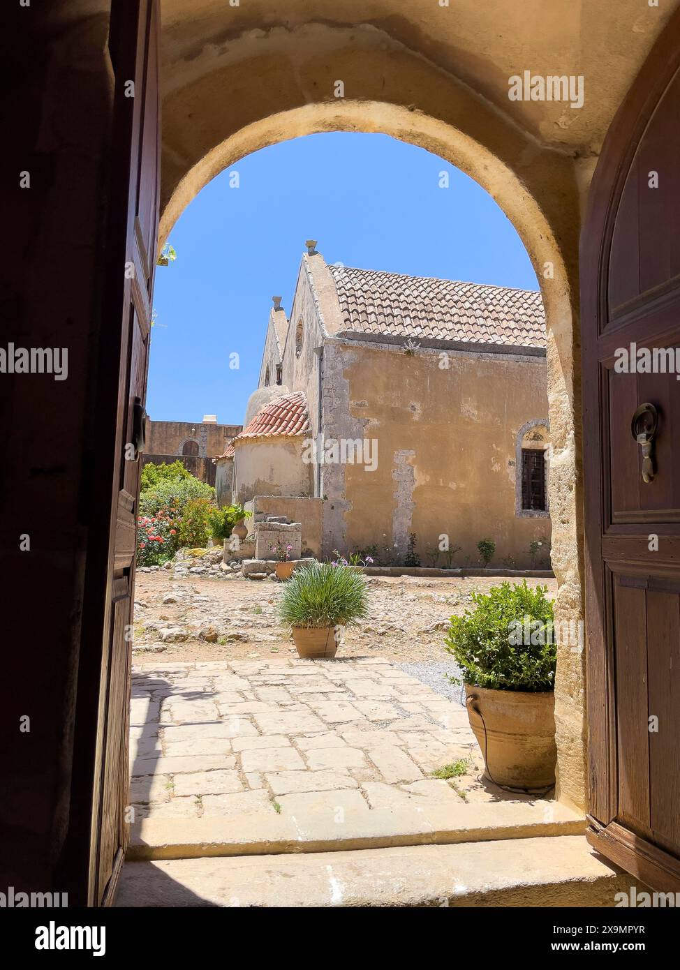 View through door Tor tor archway archway on back of two-aisled church building church monastery ...