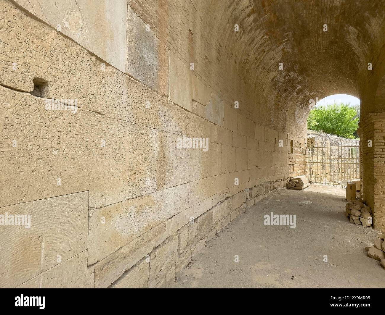 Wall of archway behind amphitheatre carved written chiselled laws City ...