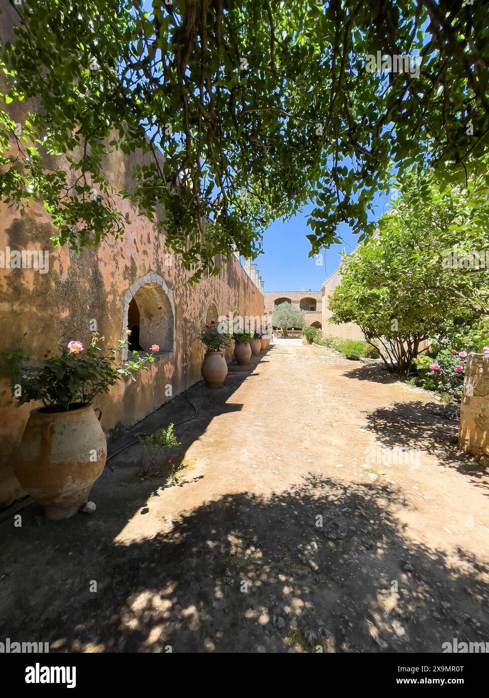 View of the inner courtyard of Arkadi Monastery left Archway in front ...