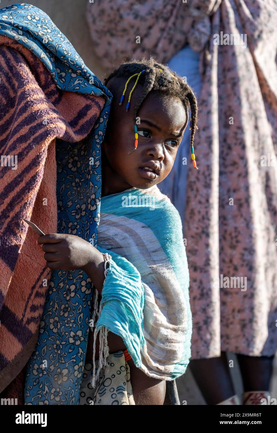 Hakaona girl with traditional hair jewellery, in the morning light ...