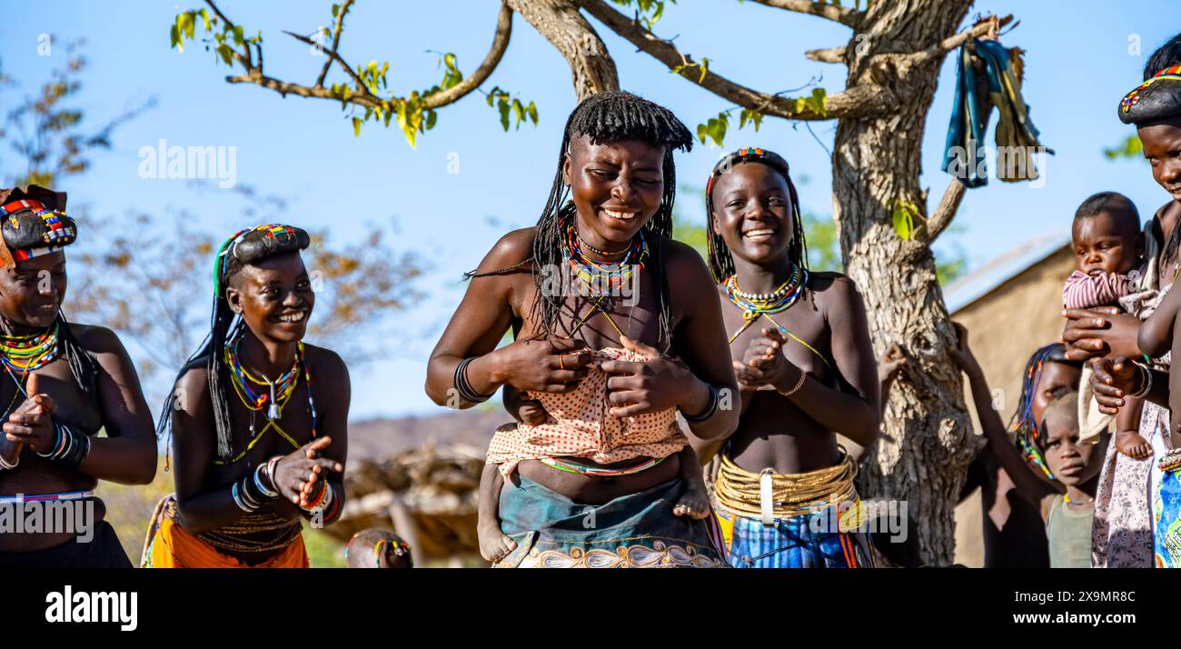 Hakaona woman with traditional kapapo hairstyle, dancing, clapping and ...