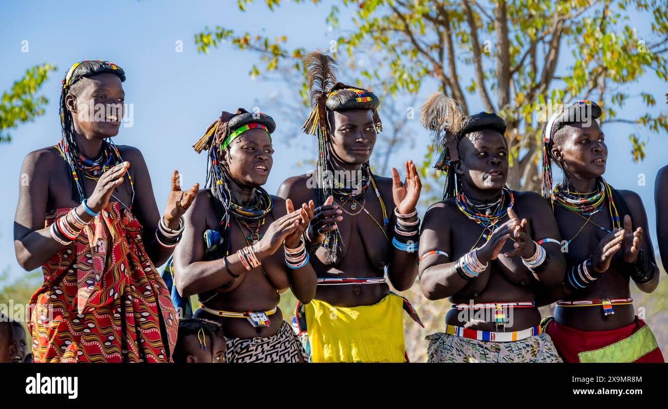 Hakaona woman with traditional kapapo hairstyle, clapping and laughing ...