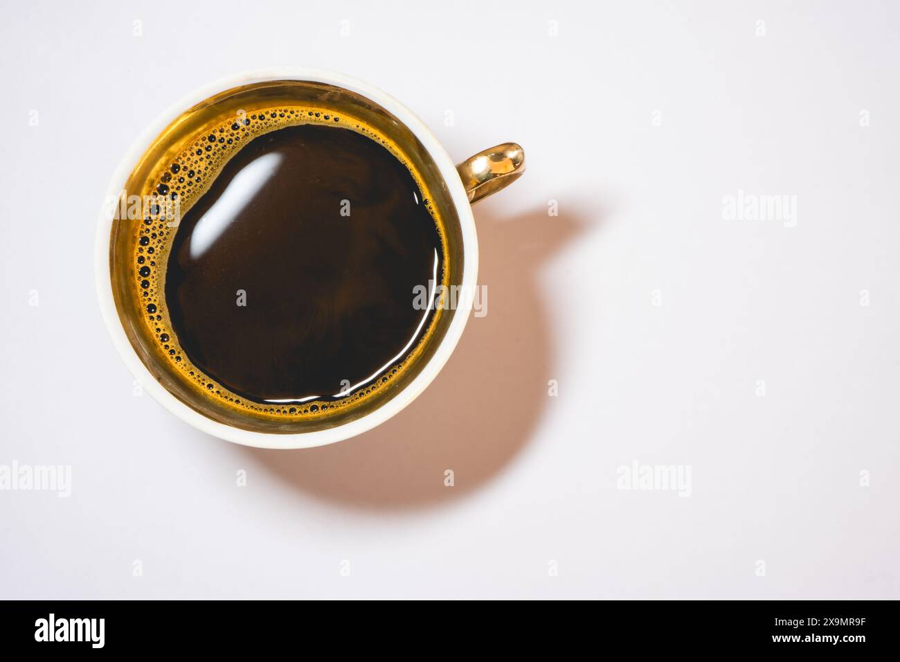 Coffee in a fancy cup on a white background Stock Photo - Alamy