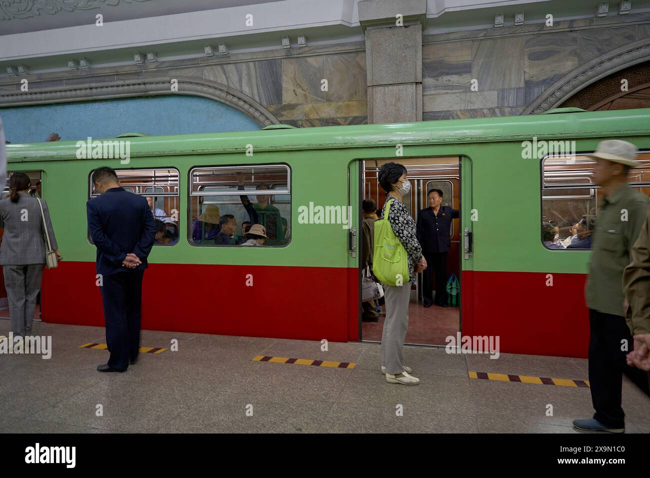 the interior of the station and passengers in the Pyongyang subway ...