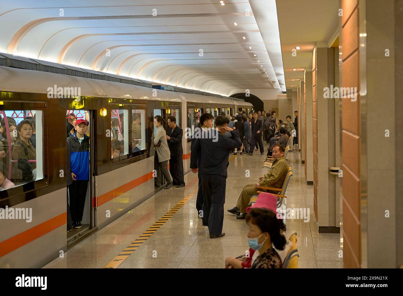 the interior of the station and passengers in the Pyongyang subway ...