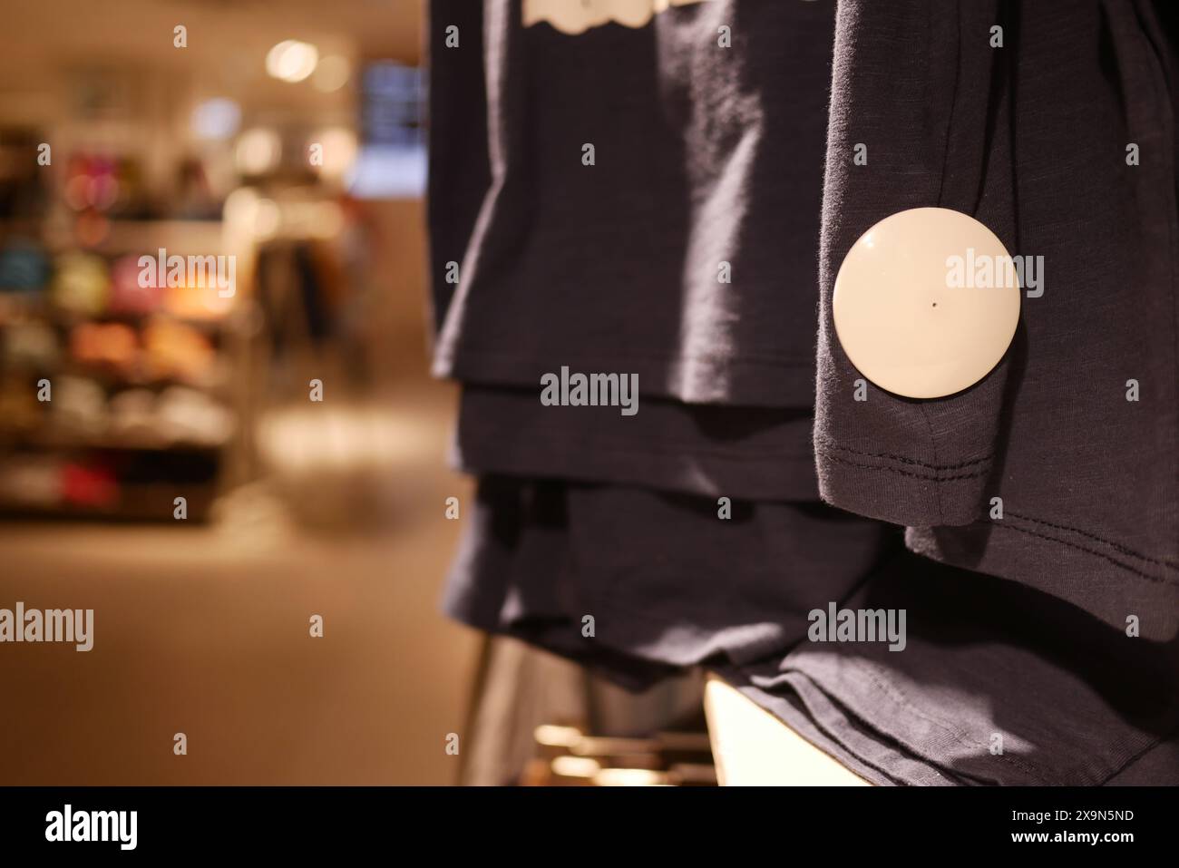 Security tags on clothes hi-res stock photography and images - Alamy