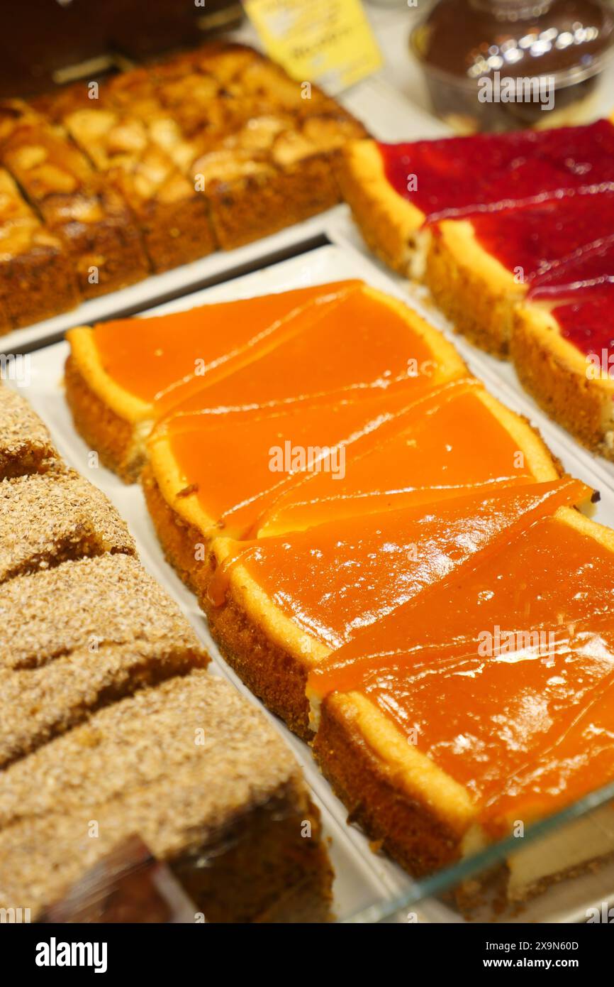An array of baked goods, including pastries, is showcased in the bakery ...