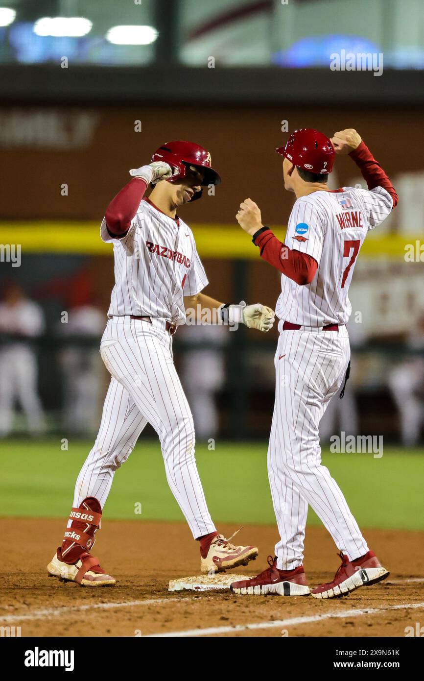 June 1, 2024: Jared Sprague-Lott #12 of Arkansas is greeted by first ...