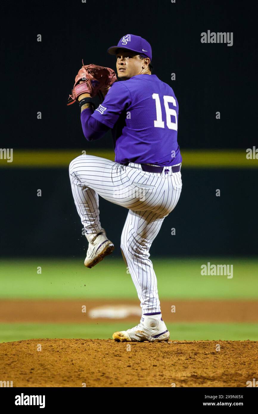 June 1, 2024:Tyson Neighbors #16 of Kansas State begins his wind up on ...