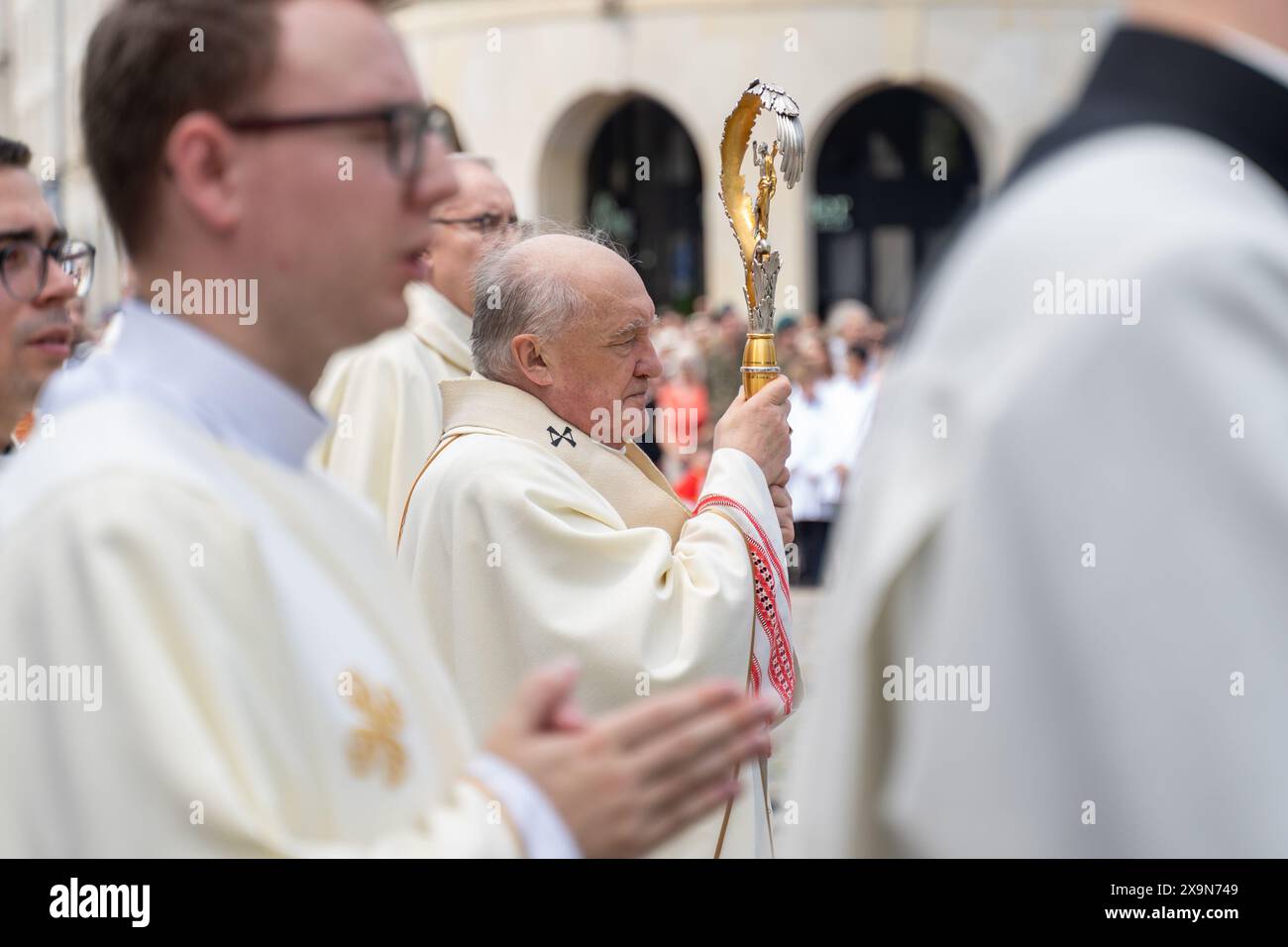 Kazimierz Nycz the Polish prelate stands surrounded by other priests ...