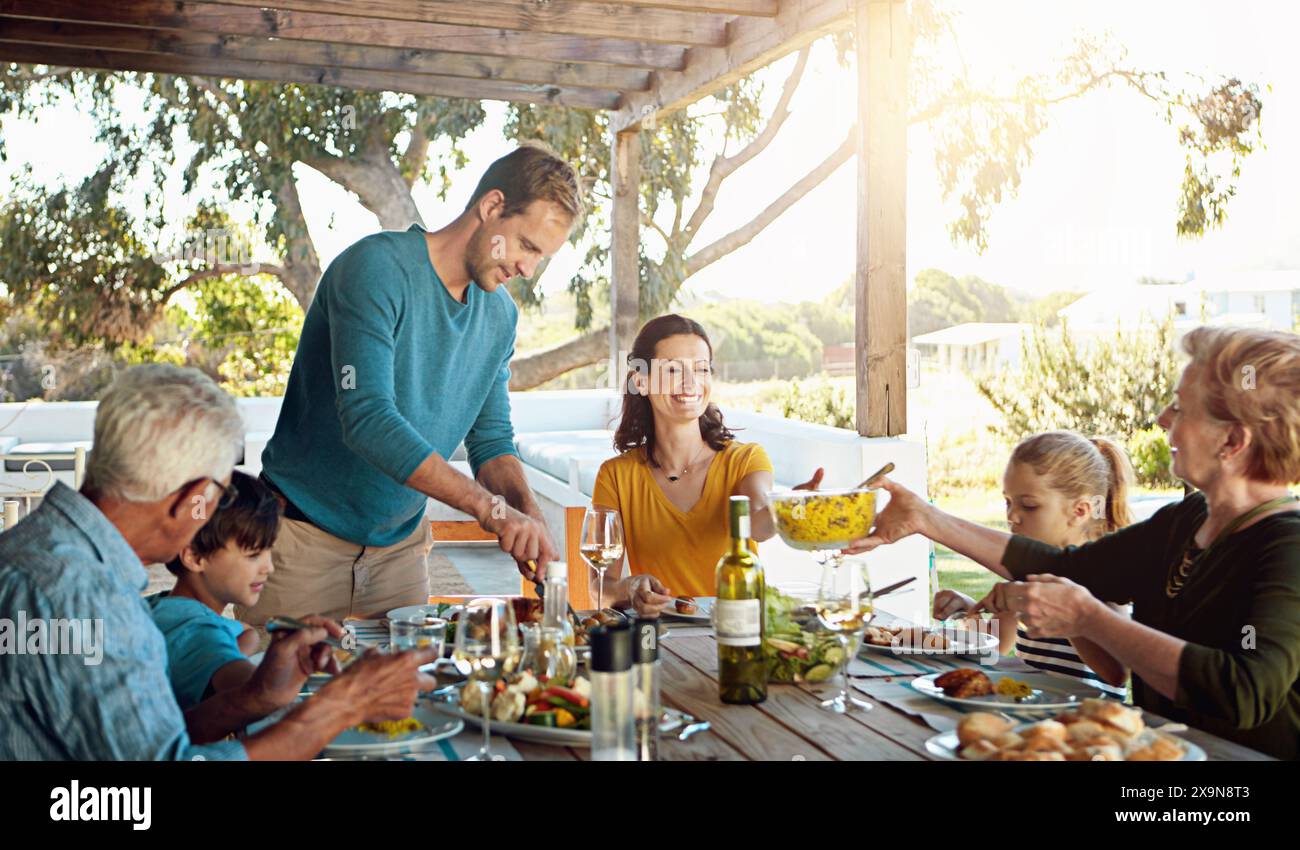 Happy family, eating and lunch with bonding outdoor on patio with ...