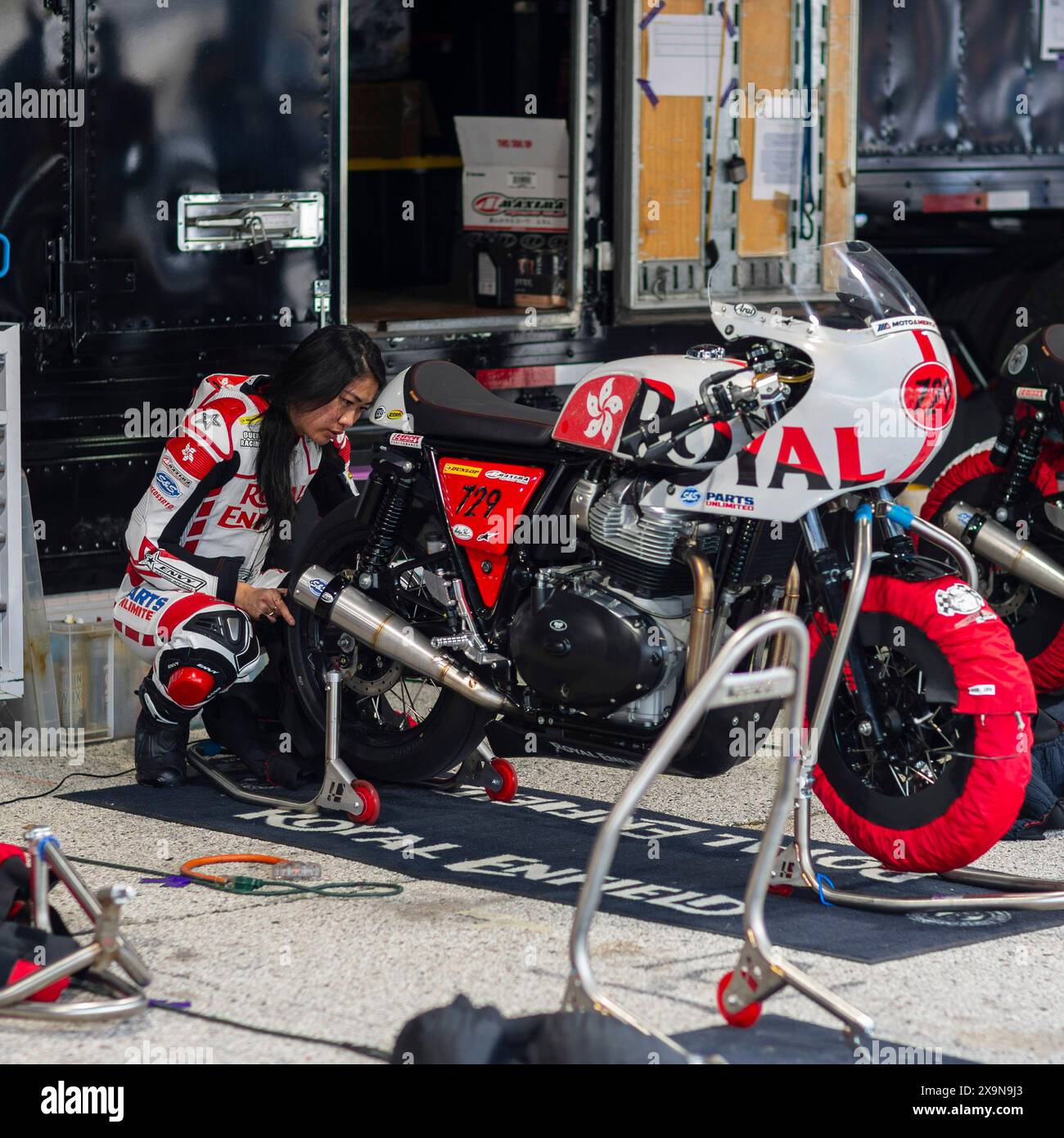 June 01, 2024: Royal Enfield rider #729 Pearltry Suen works on her ...