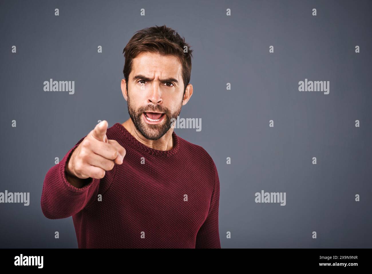 Studio, angry and portrait of man, pointing and accountability for you ...