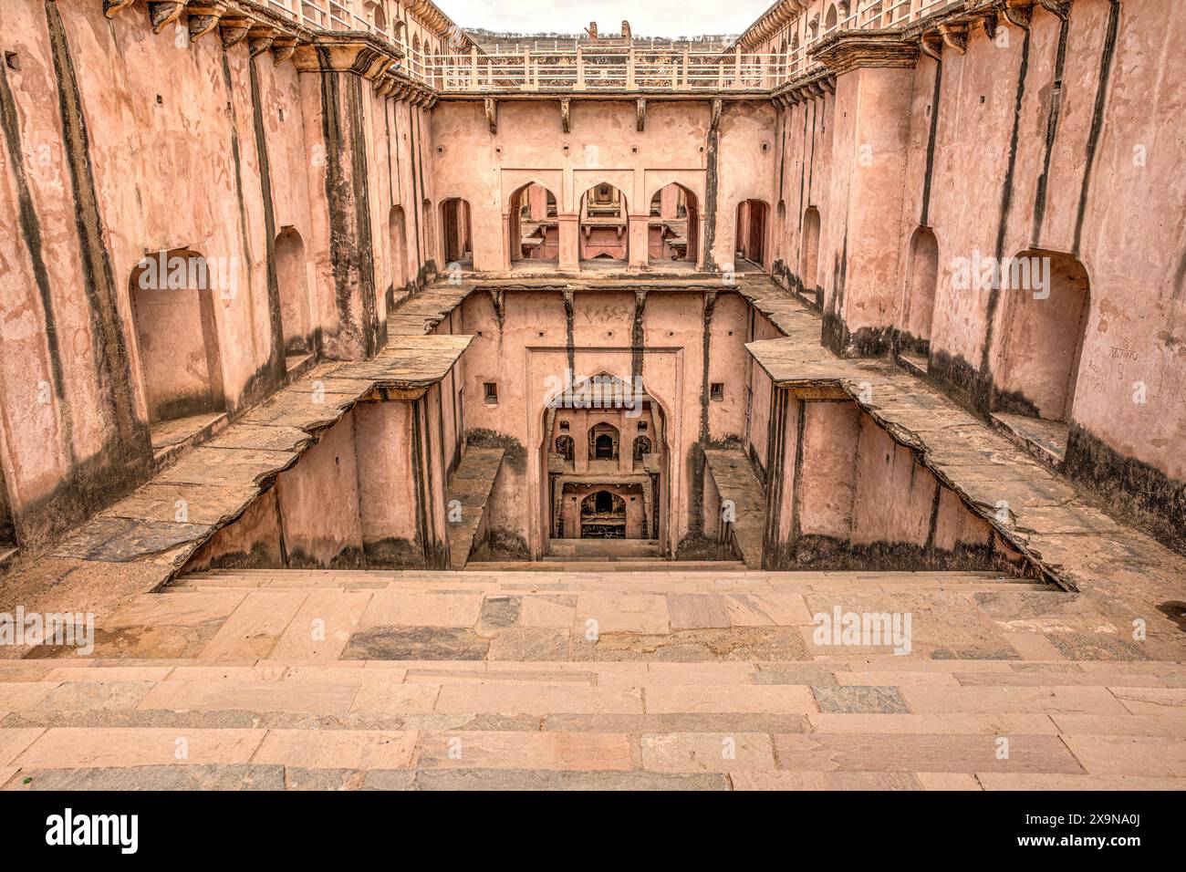 bawdi deep water step well Stock Photo - Alamy