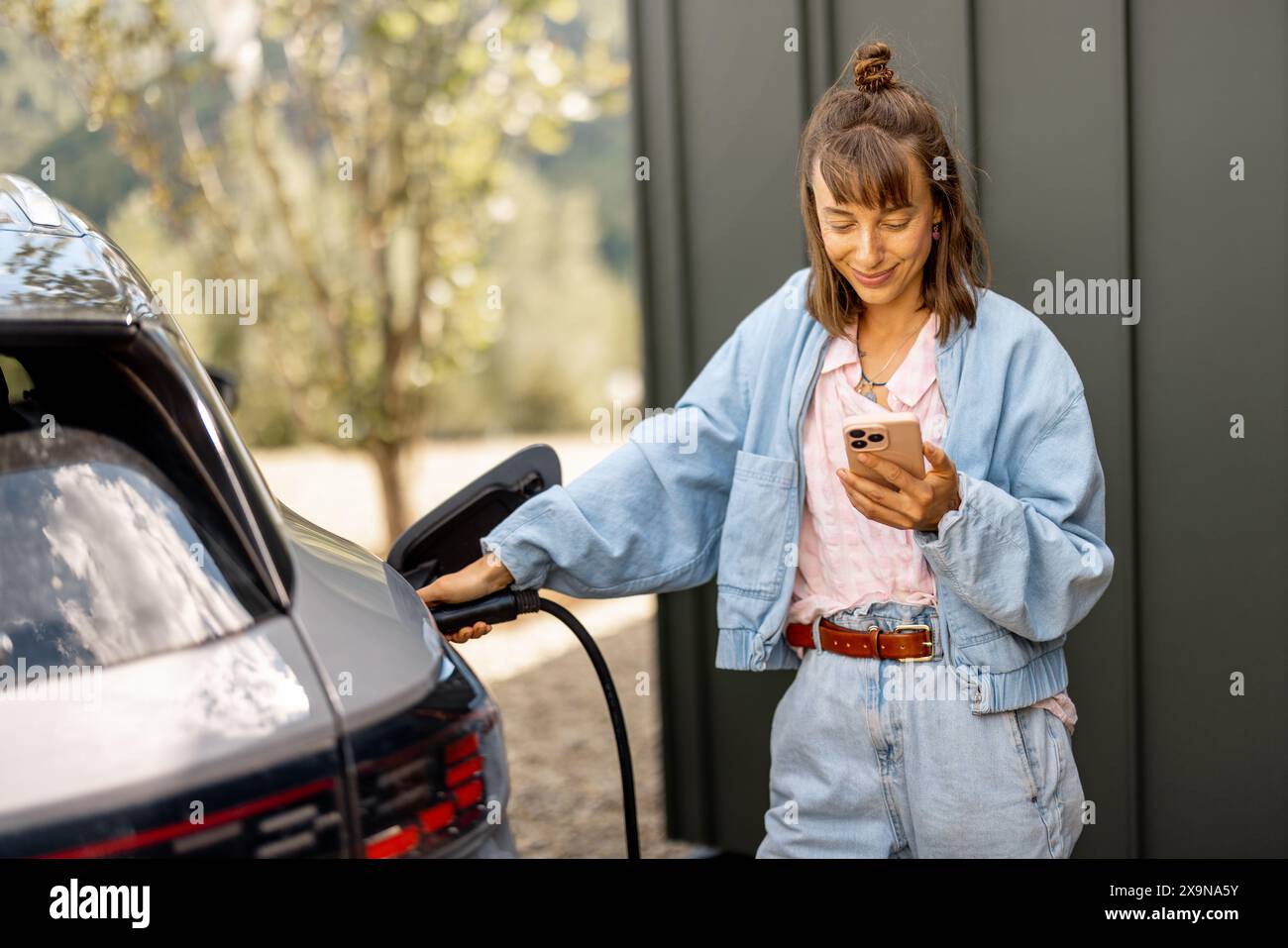 Woman plugging smartphone power hi-res stock photography and images - Alamy
