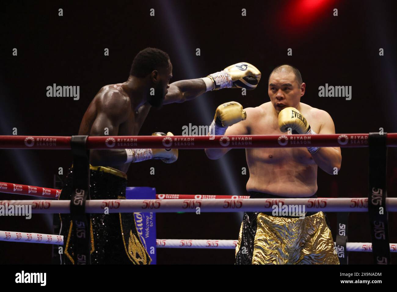 Riyadh, Saudi Arabia. 2nd June, 2024. Zhang Zhilei (R) of China fights ...