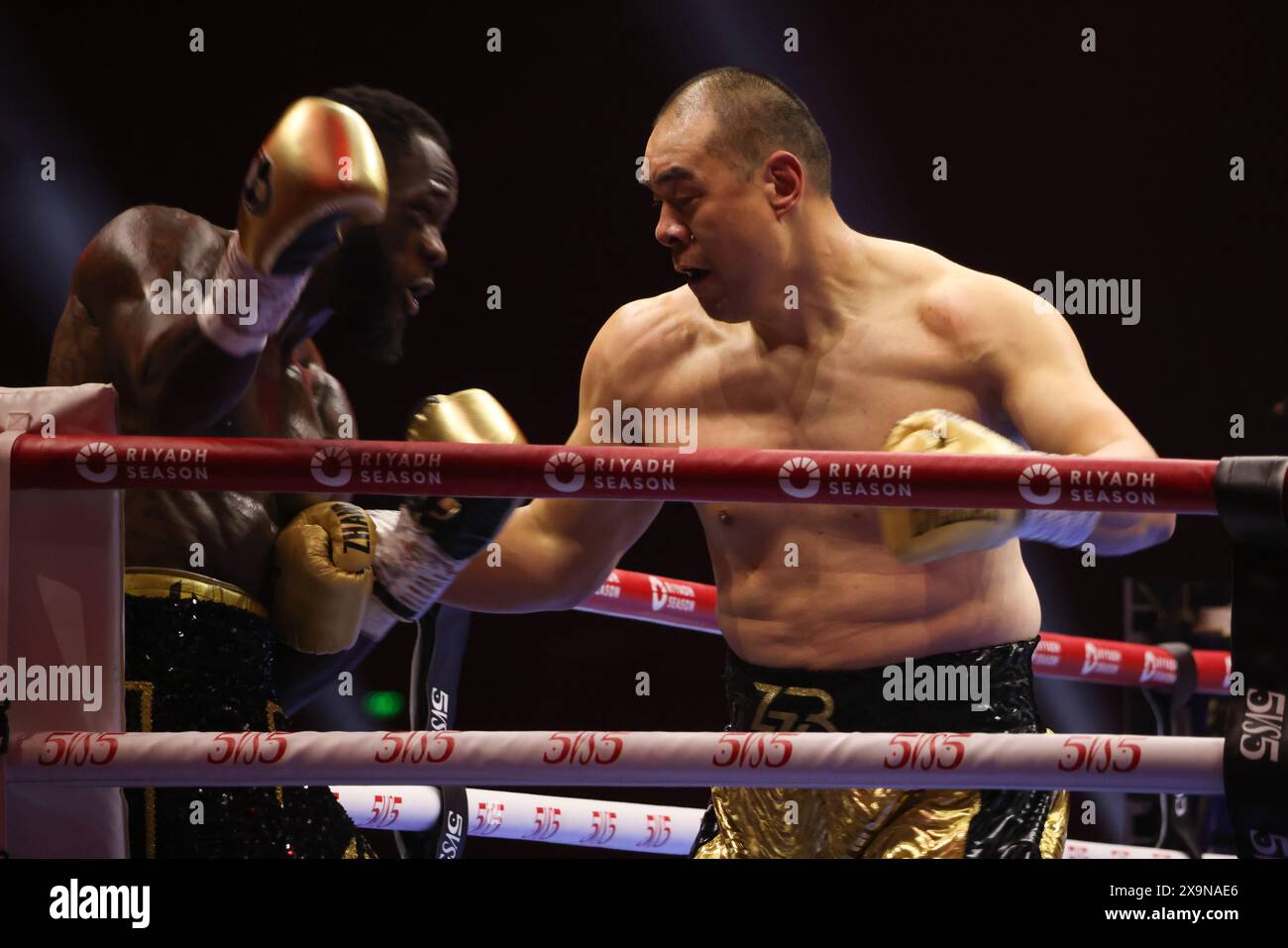 Riyadh, Saudi Arabia. 2nd June, 2024. Zhang Zhilei (R) of China fights ...
