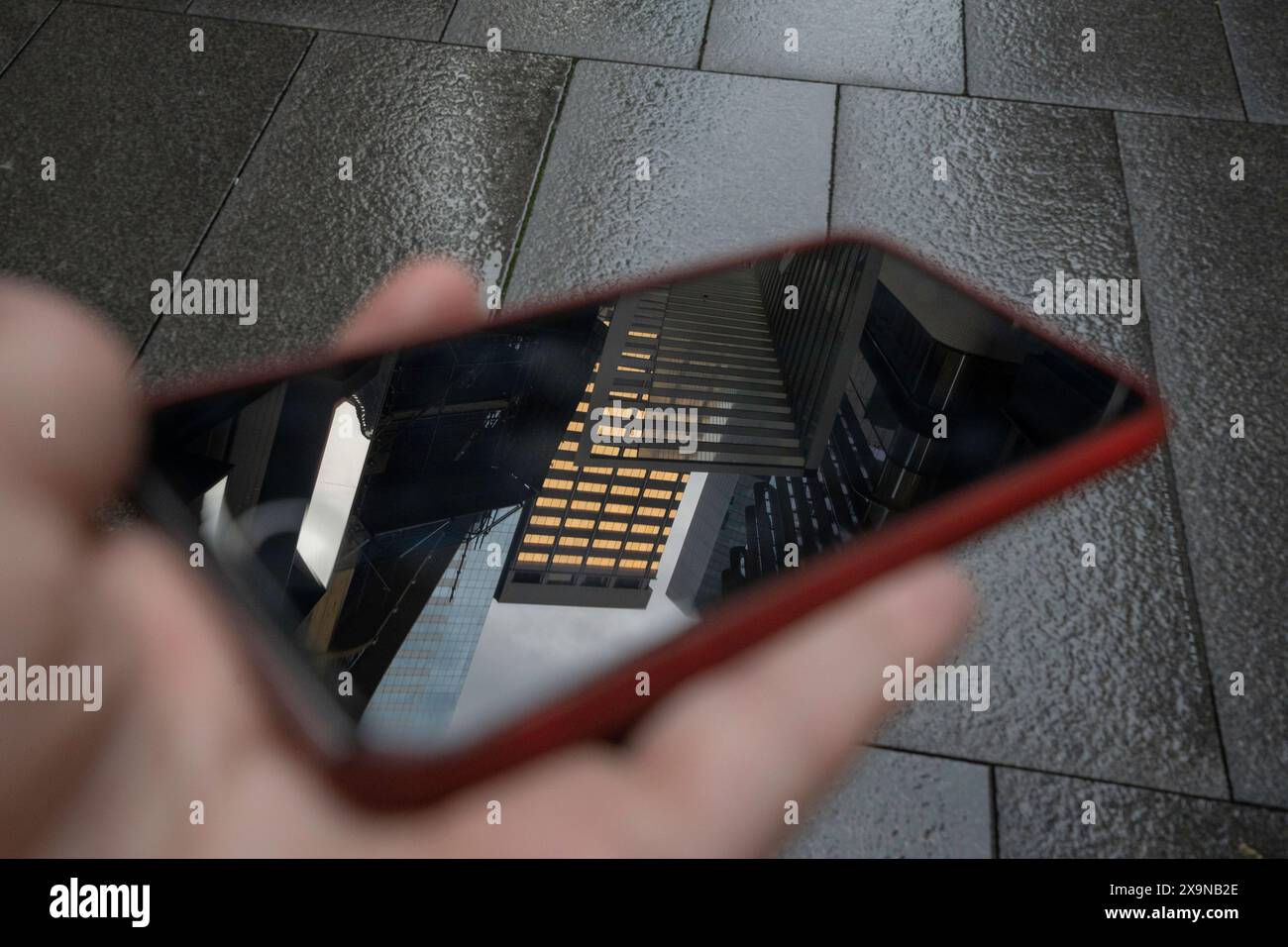 Reflections from on a smart phone screen of a city building Stock Photo ...