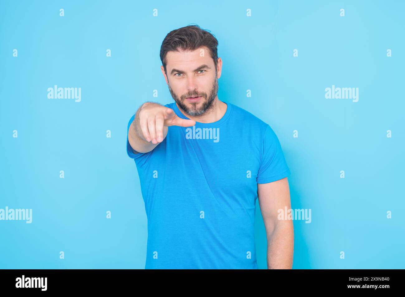 Gesture pointing finger at you. The point you. Happy handsome man ...