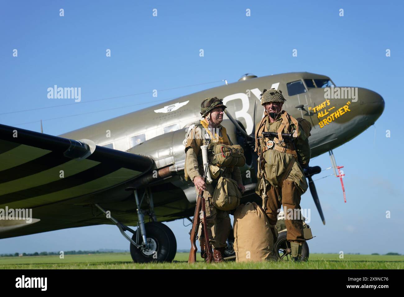 Reenactors Mark Bailey (left) and Neil Hannant pose by a Douglas C47 ...