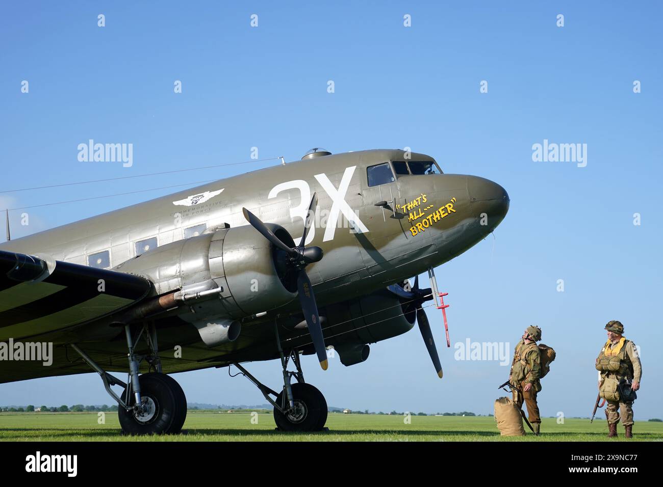 Reenactors Mark Bailey (left) and Neil Hannant pose by a Douglas C47 ...