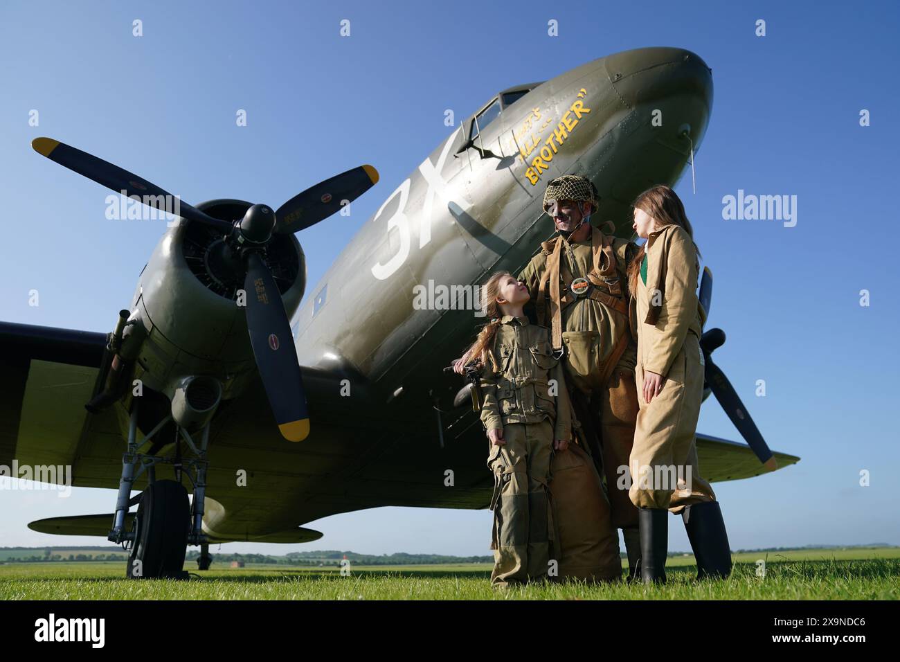Neil Hannant and his daughters Quinn (left) and Dakota (right) pose by ...