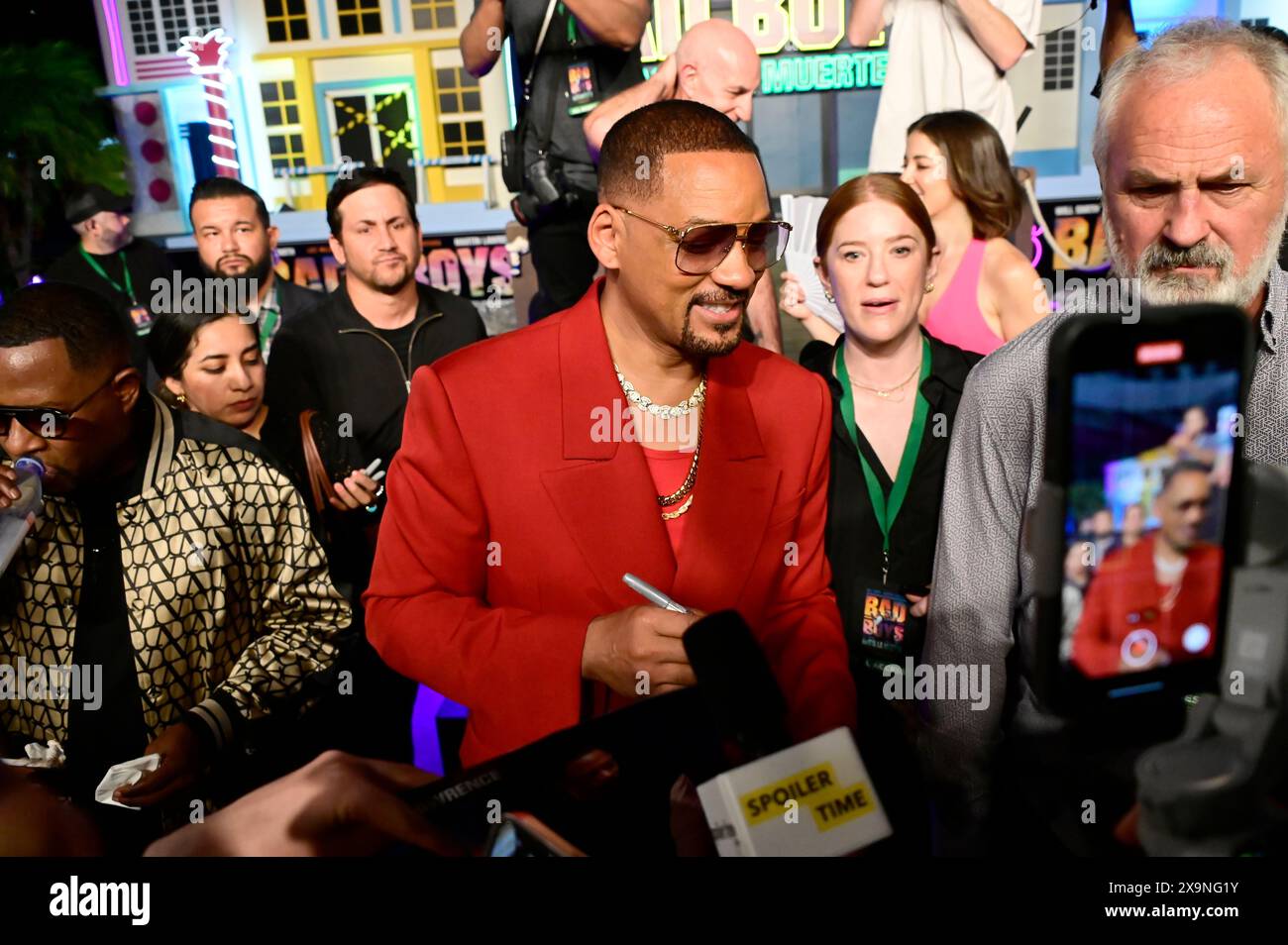 Actor Will Smith is signing autographs during the red carpet of the Bad ...
