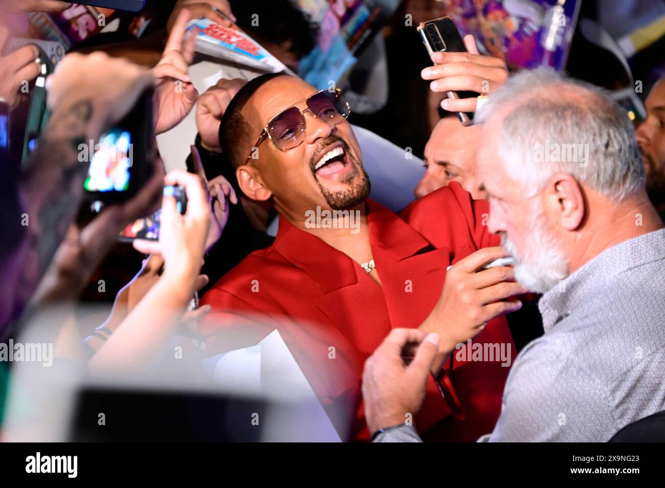 Actor Will Smith is signing autographs during the red carpet of the Bad ...
