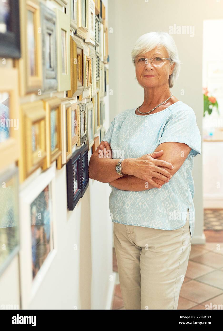Senior woman, portrait and photograph in home, confident and remember ...