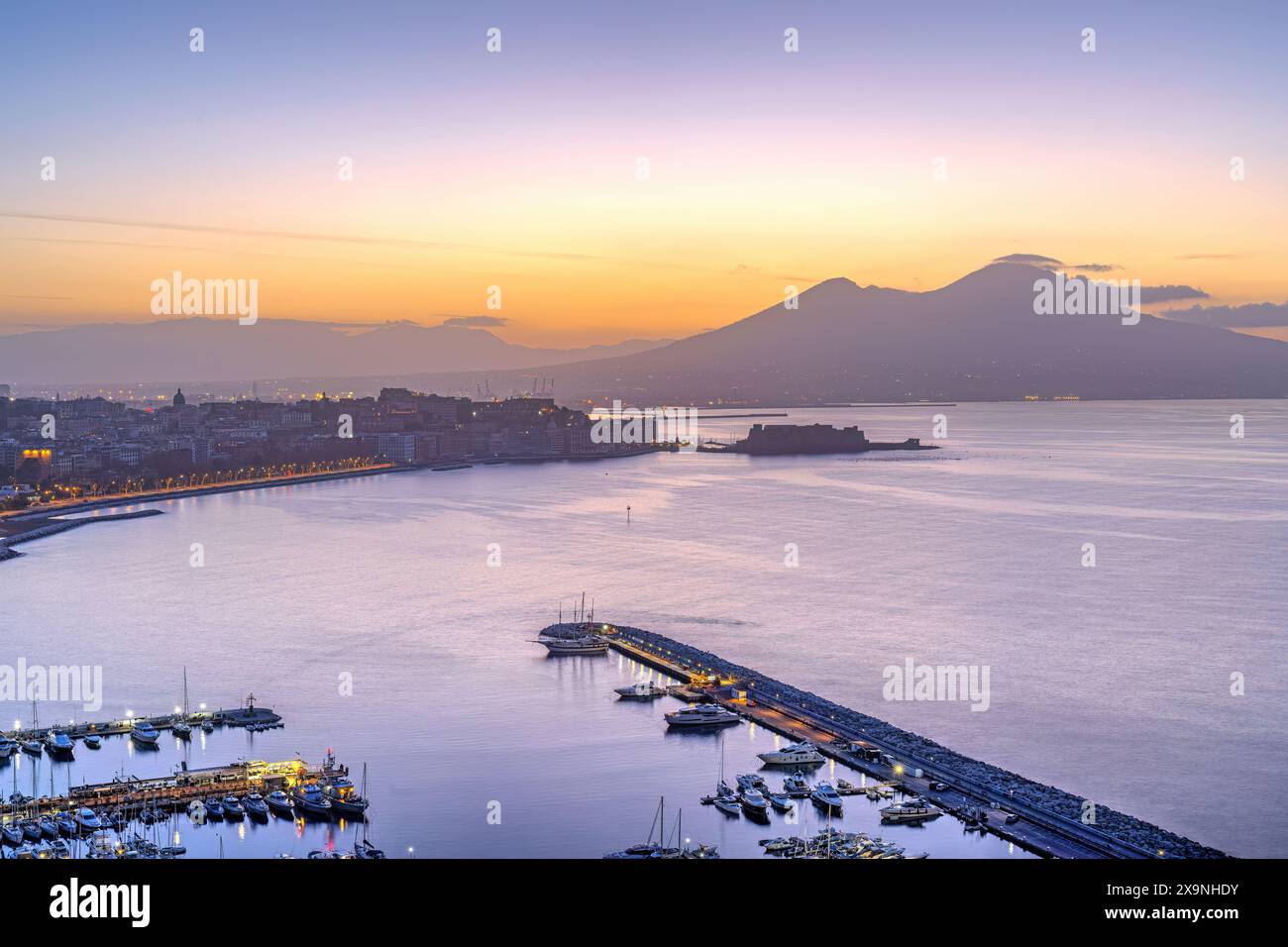 Naples with the famous Mount Vesuvius at twilight Stock Photo - Alamy