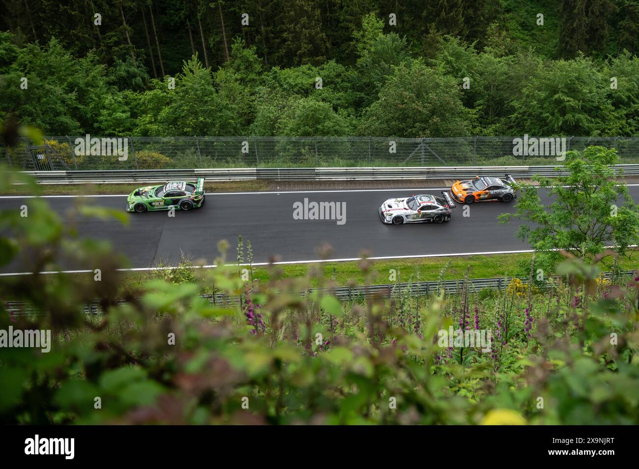 01 June 2024, Rhineland-Palatinate, Nürburg: Racing cars drive at the ...