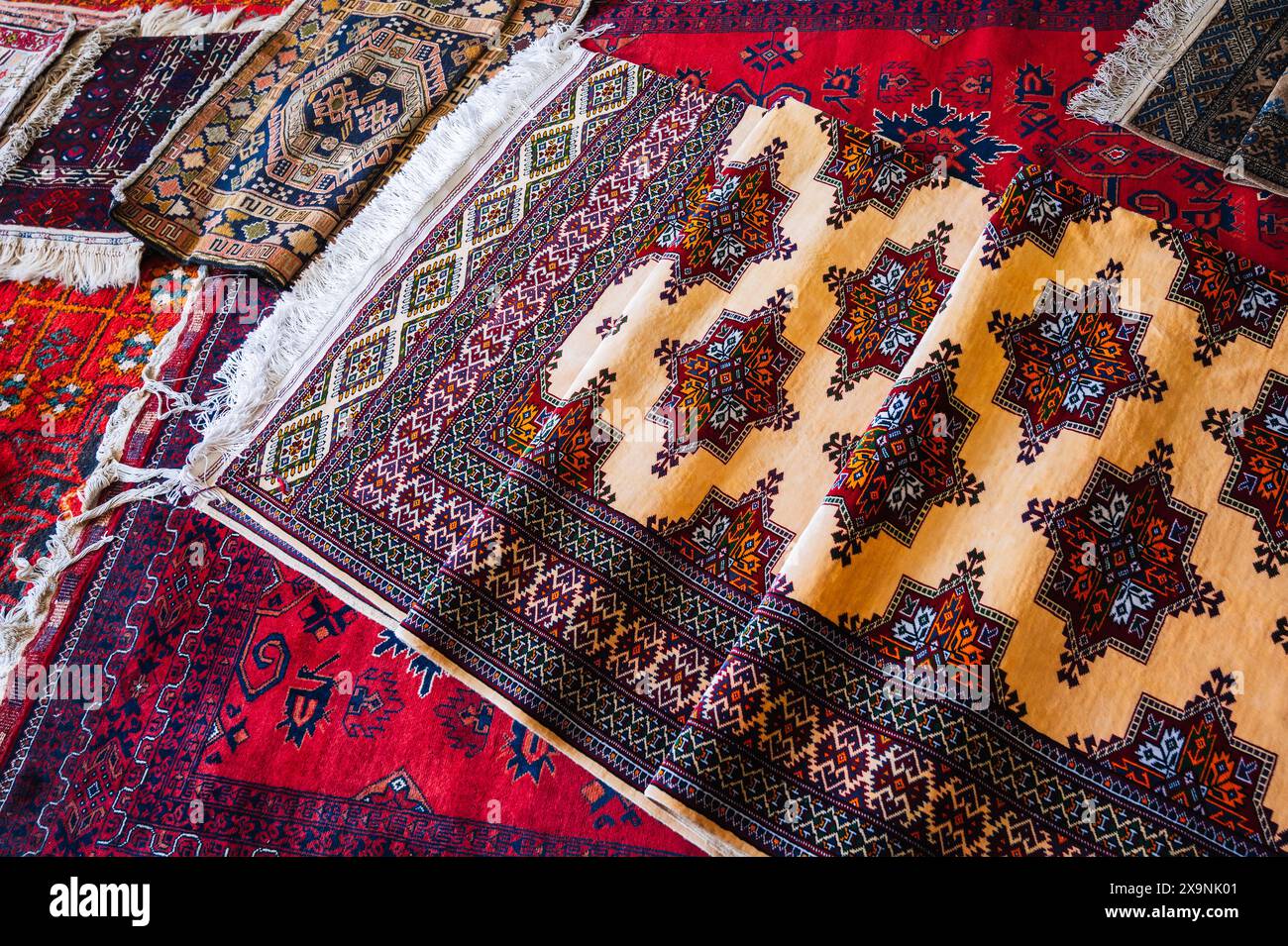 traditional oriental Asian handmade carpets at the market in Uzbekistan ...