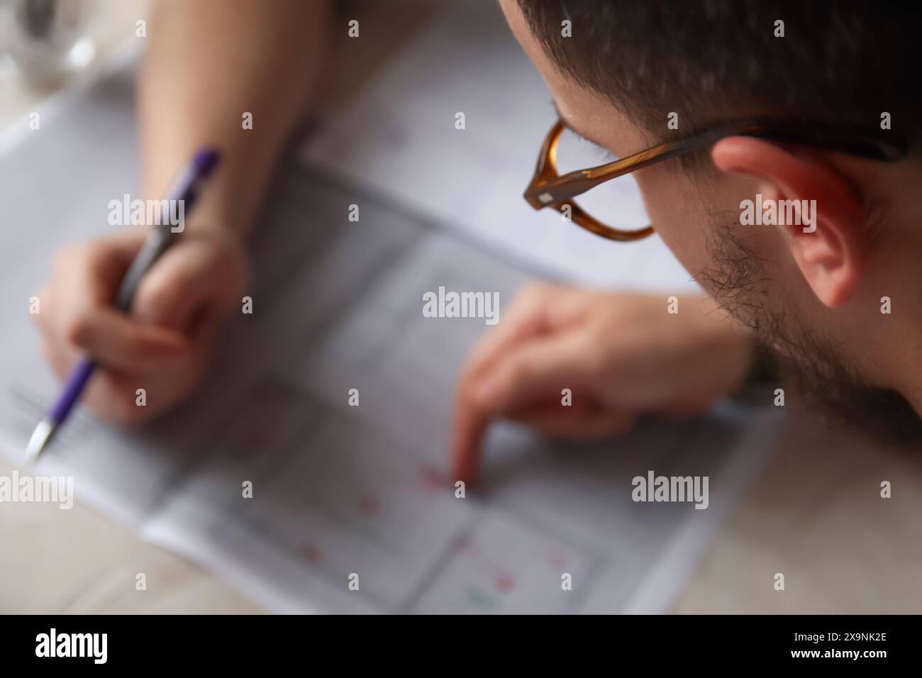 Team of architects planning, close-up of architectural drawing, office ...