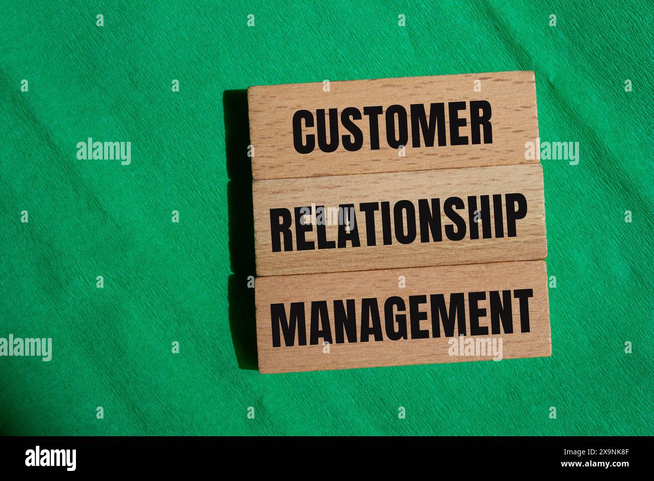 Customer relationship management words written on wooden blocks with ...