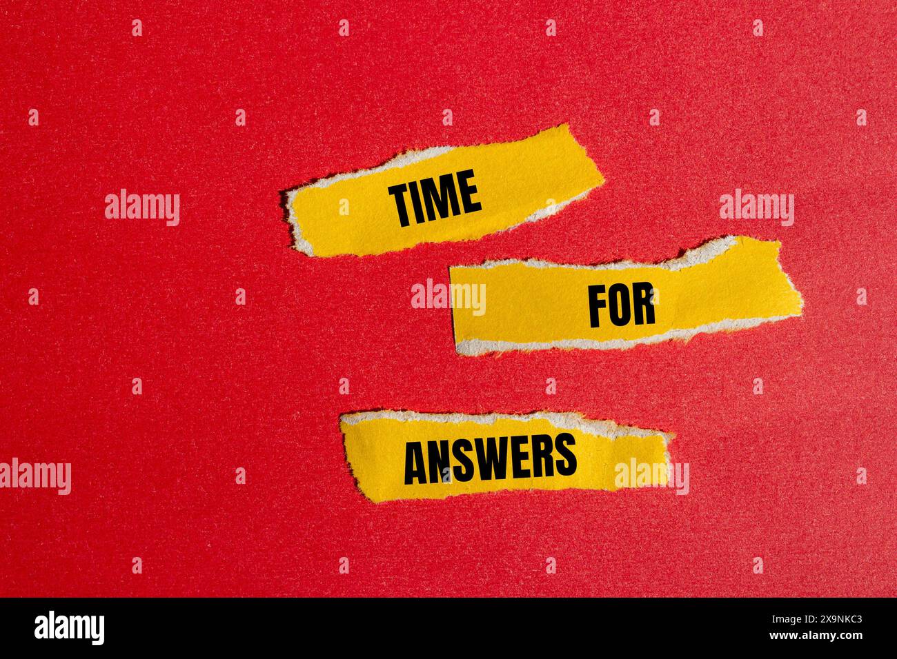 Time for answers words written on ripped yellow paper pieces with red ...