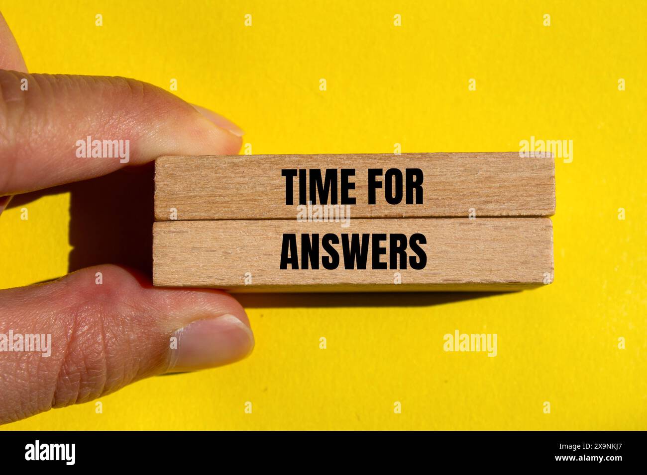 Time for answers words written on wooden blocks with yellow background ...