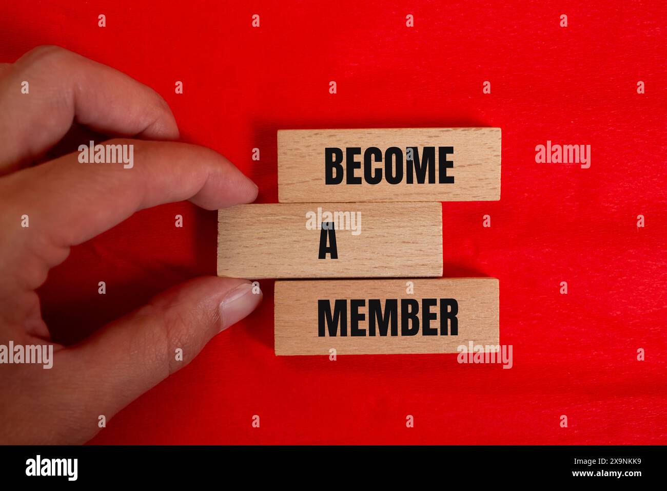 Become a member message written on wooden blocks with color background ...