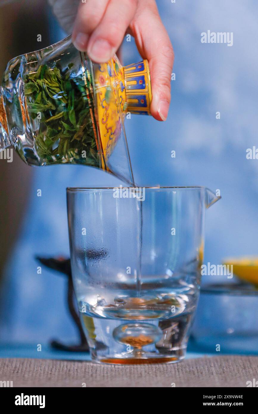 (240602) -- HUANGSHAN, June 2, 2024 (Xinhua) -- Wang Sun makes tea at ...