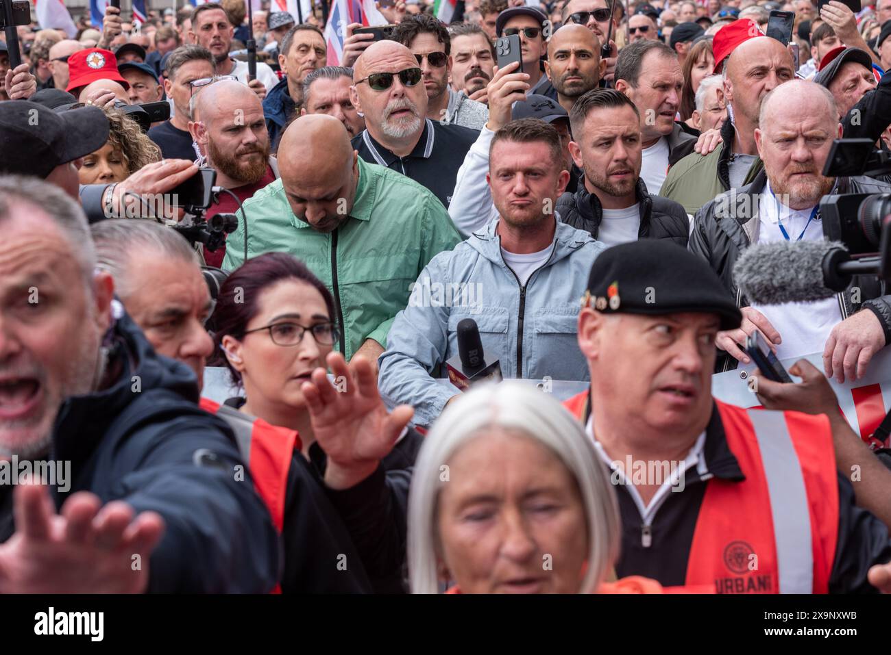 Tommy Robinson at a two-tier policing protest rally, heading a march to ...