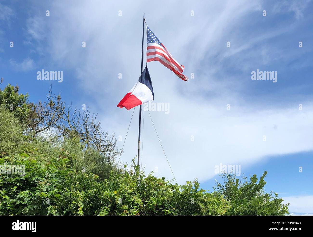 Saint Laurent Sur Mer, France. 30th May, 2024. A US and a French flag ...