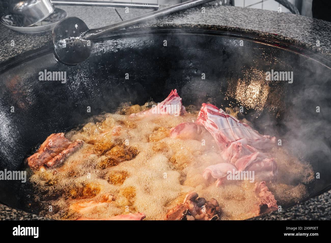 Cauldron boiling oil hi-res stock photography and images - Alamy