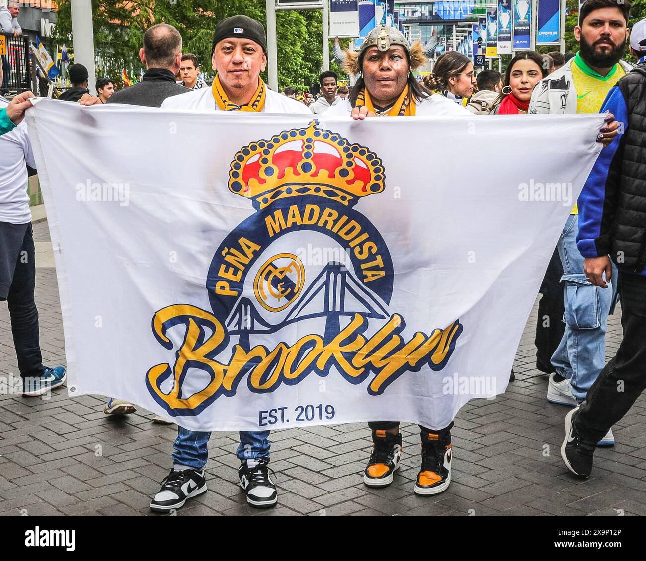 London, UK. 01st June, 2024. Real Madrid fans pose with a large flag ...